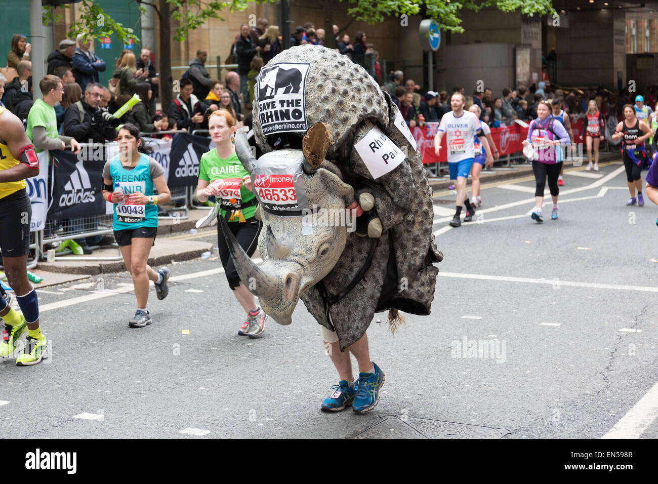 Man dressed as a Rhino running at the 2015 Virgin Money London Marathon ...