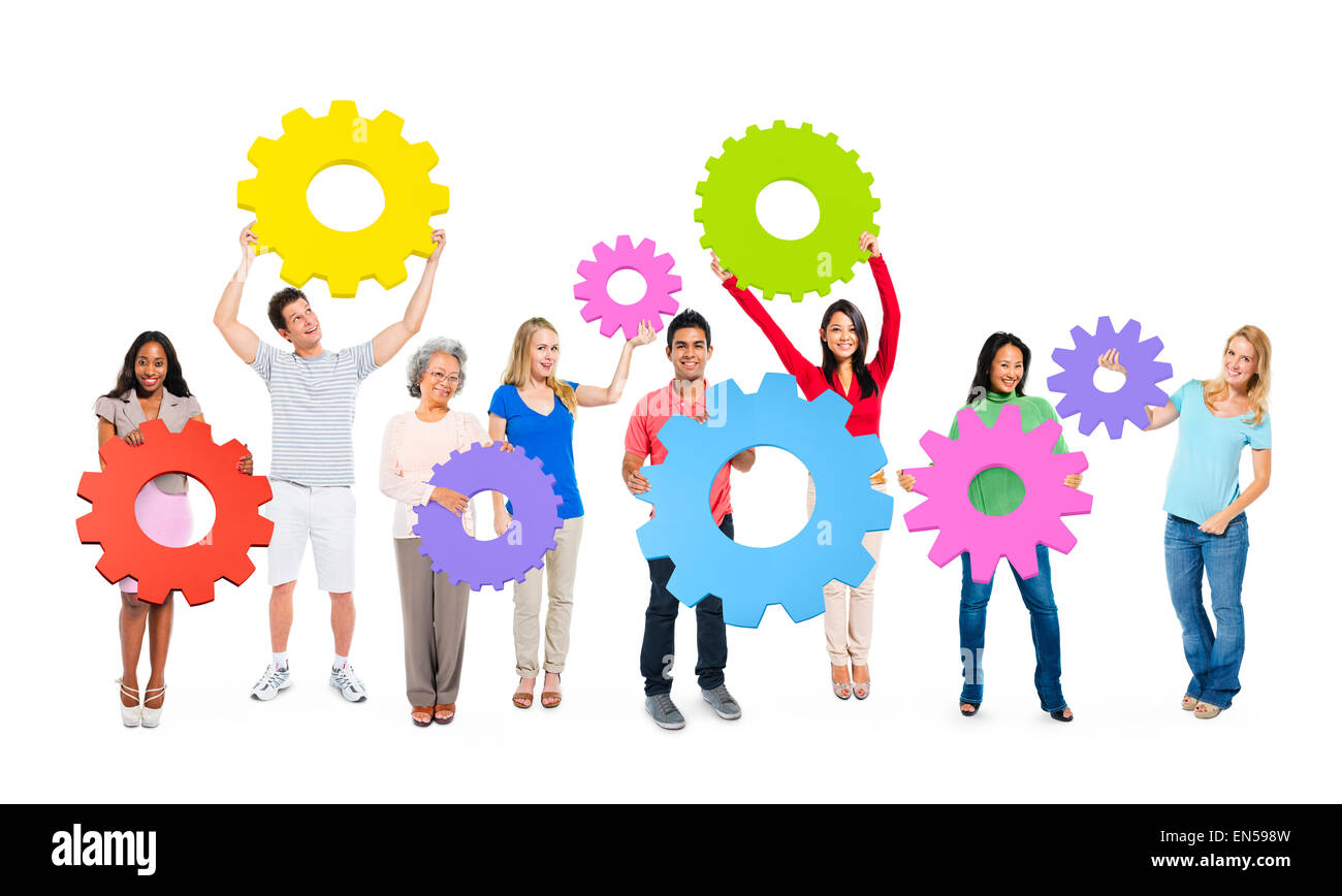 Group of Multiethnic People Holding Colorful Cogs Stock Photo - Alamy