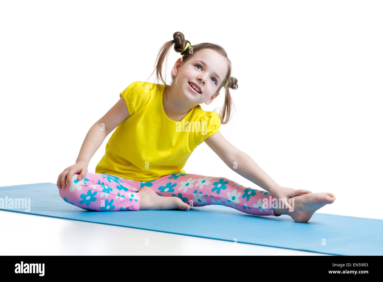 Little cute girl doing yoga hi-res stock photography and images - Alamy