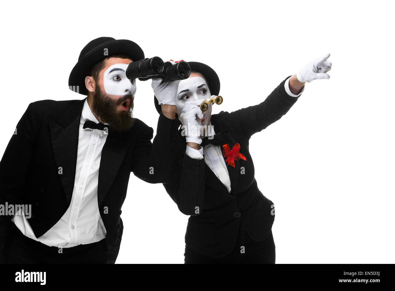 Two memes as business people looking through binoculars Stock Photo - Alamy