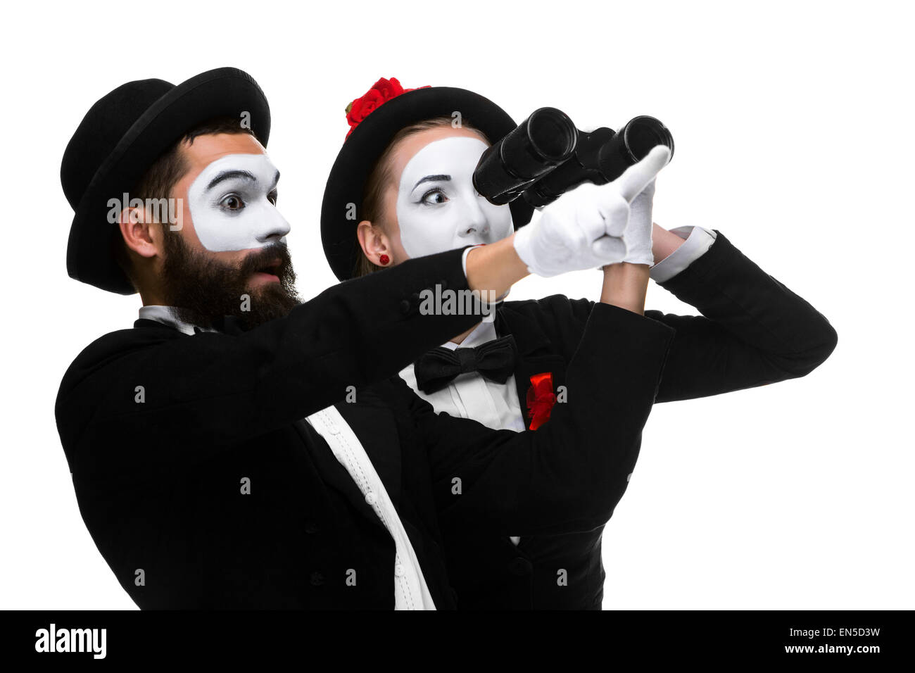 Two memes as business people looking through binoculars Stock Photo - Alamy