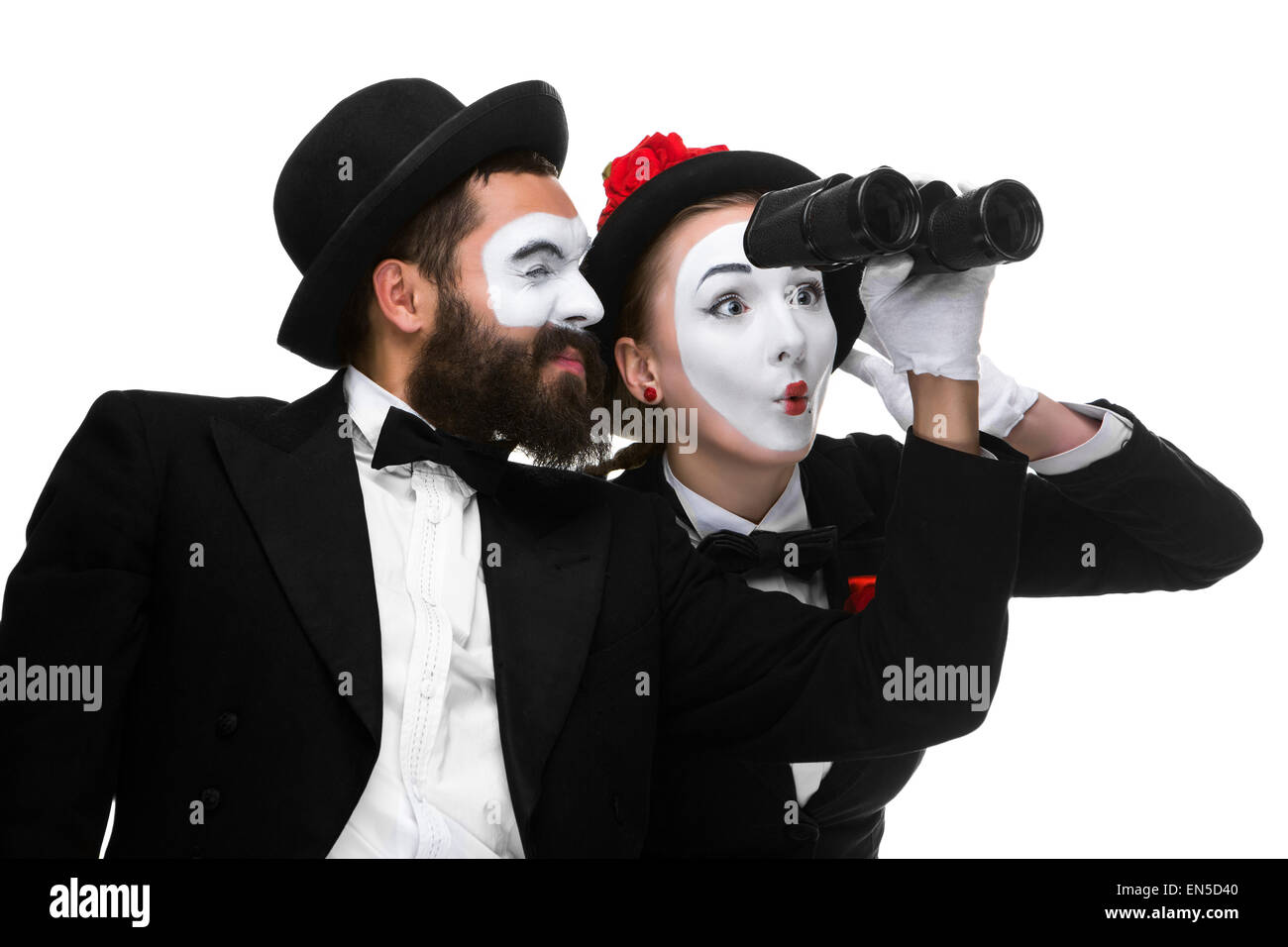 Two memes as business people looking through binoculars Stock Photo - Alamy