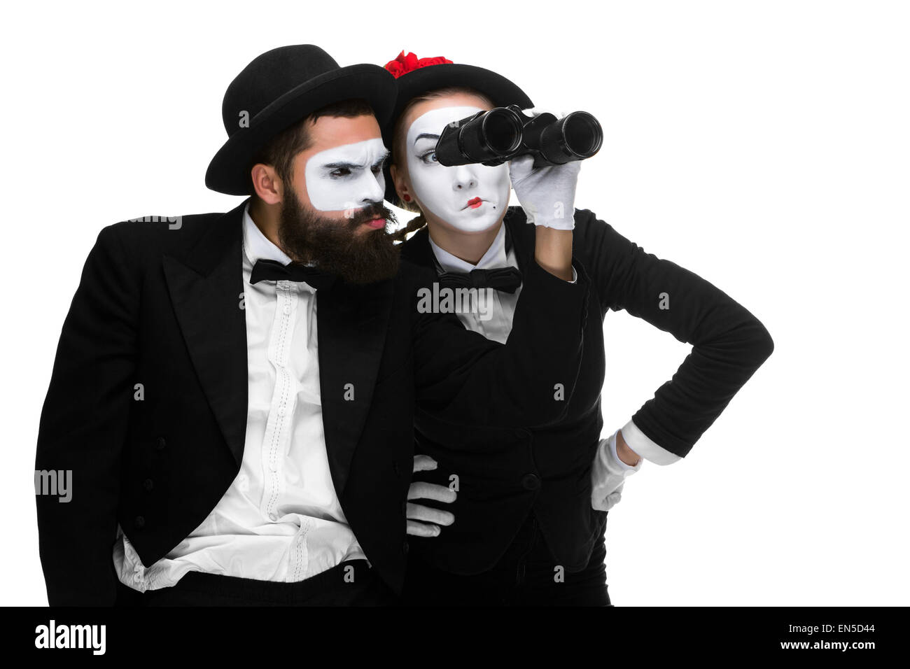 Two memes as business people looking through binoculars Stock Photo - Alamy