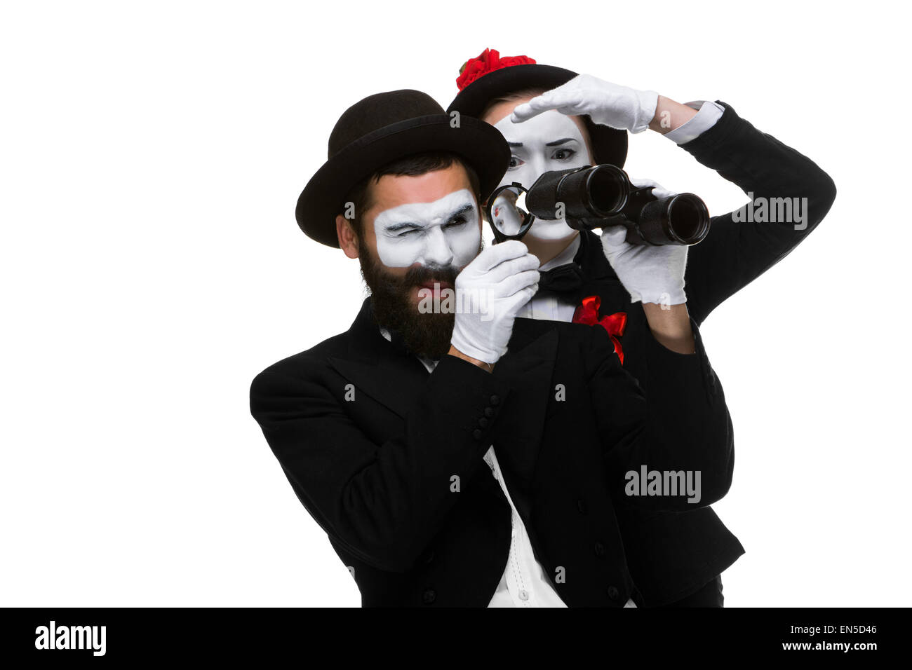 Two memes as business people looking through binoculars Stock Photo - Alamy