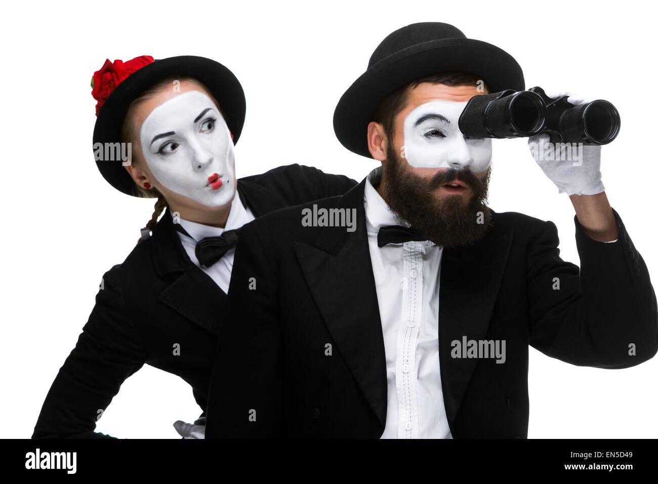 Two memes as business people looking through binoculars Stock Photo - Alamy