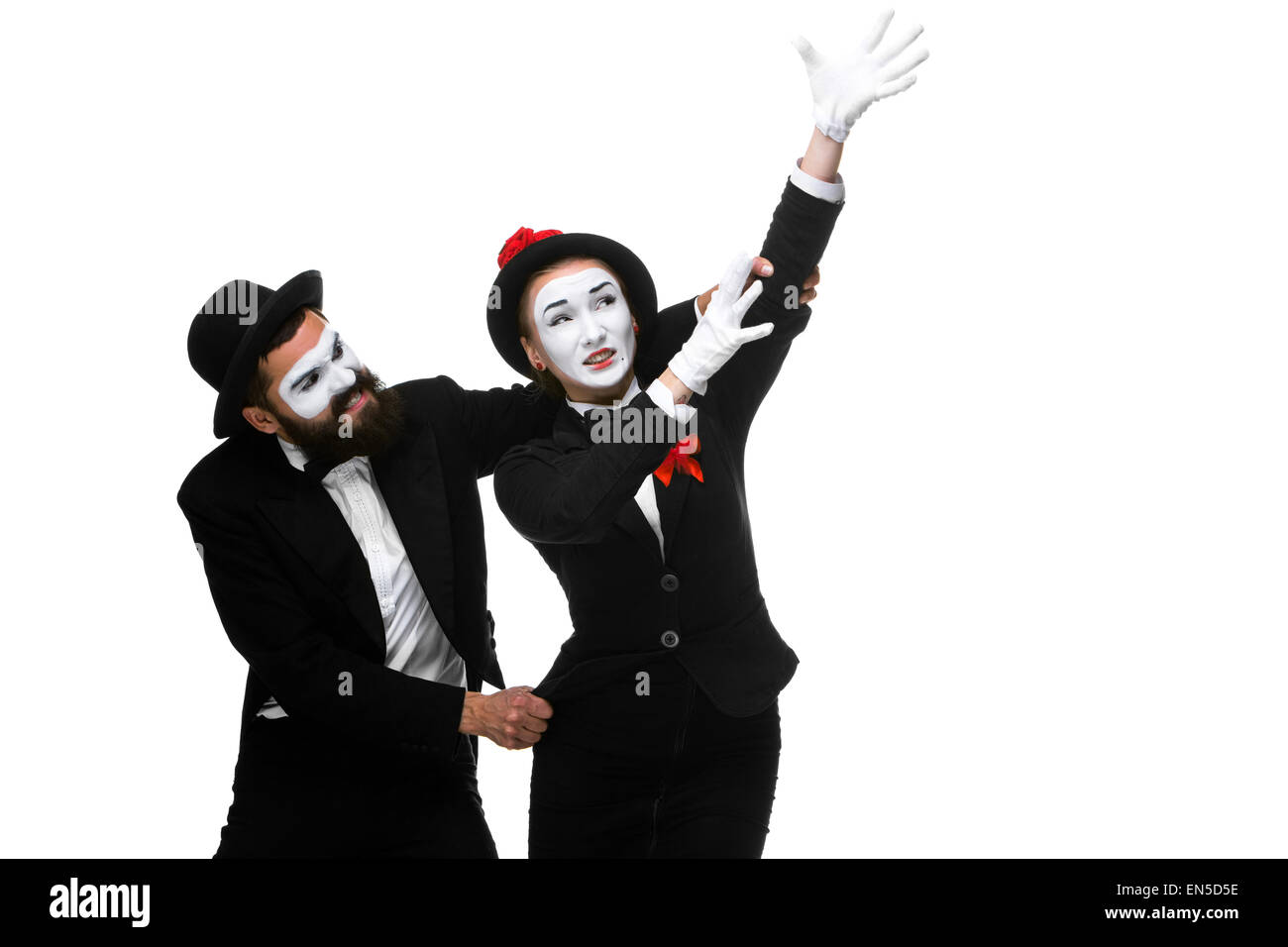 mime holding another one up and running Stock Photo - Alamy