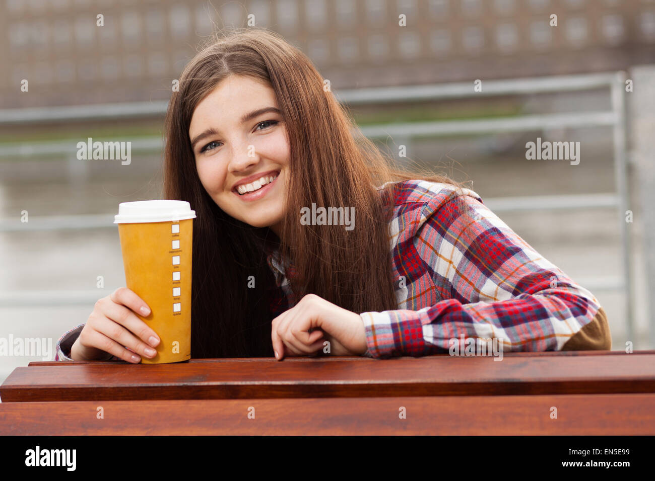Young woman drinking coffee Stock Photo - Alamy