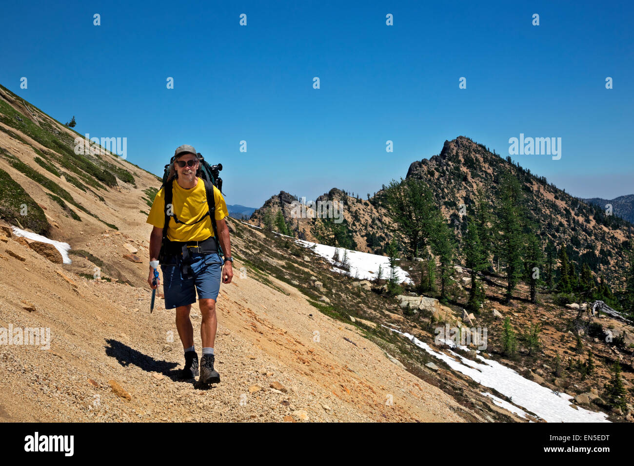 WASHINGTON - Hiker on Pacific Crest Tail north of Cutthroat Pass in the ...
