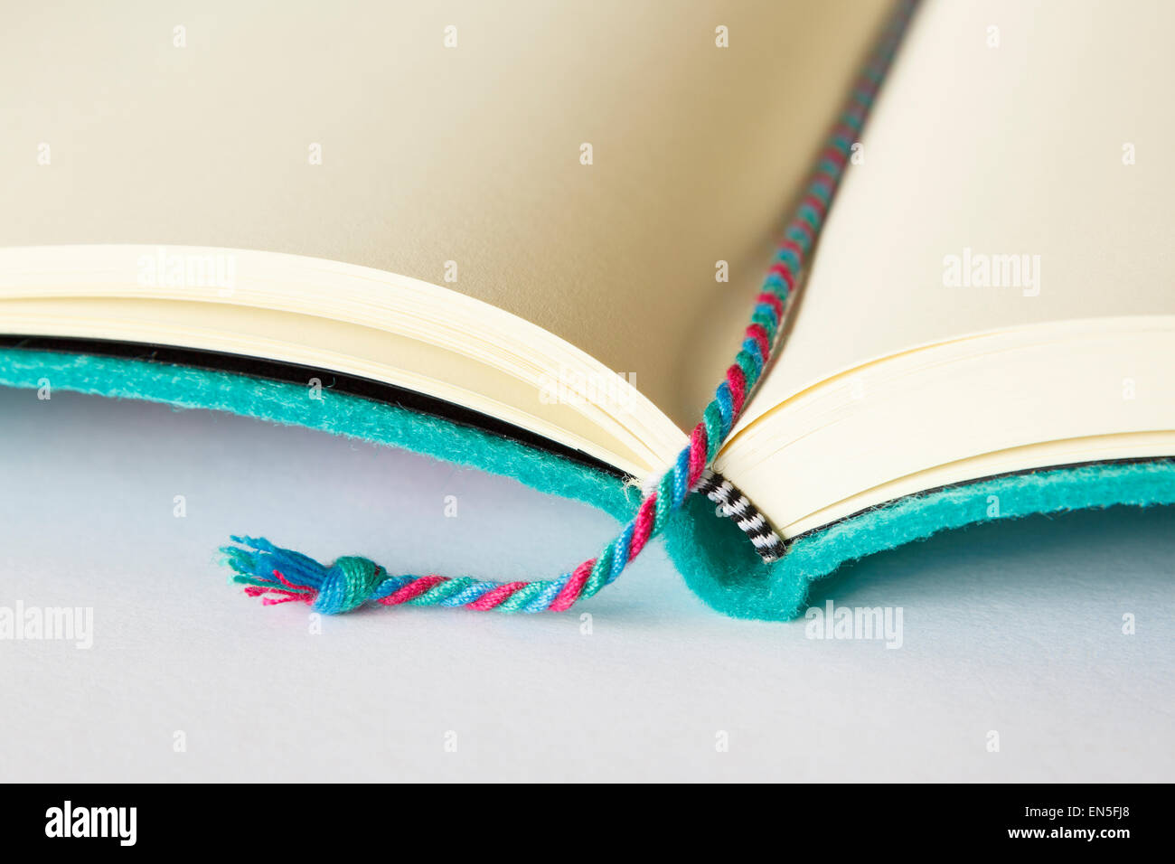 Open blank notebook note book with a bookmark marking the page on a ...