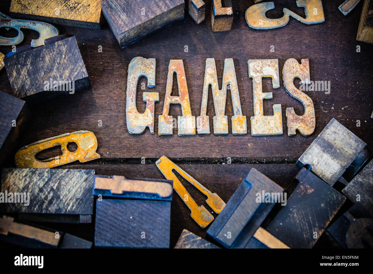The word GAMES written in rusted metal letters surrounded by vintage ...