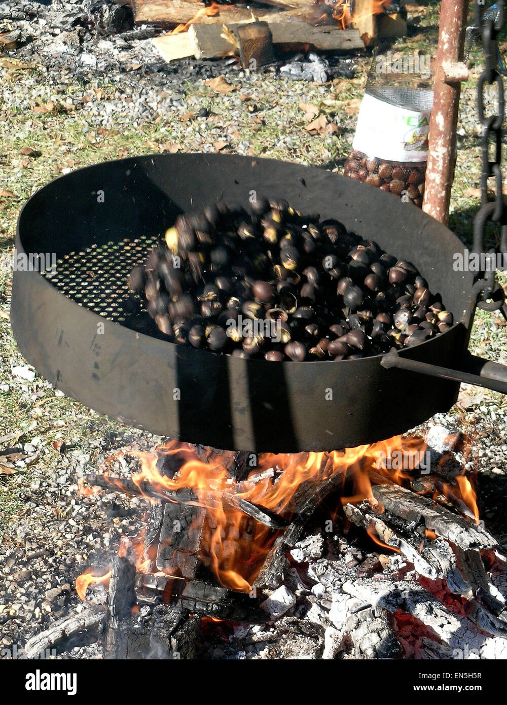 italian and traditional food, chestnuts cooked on fire Stock Photo - Alamy