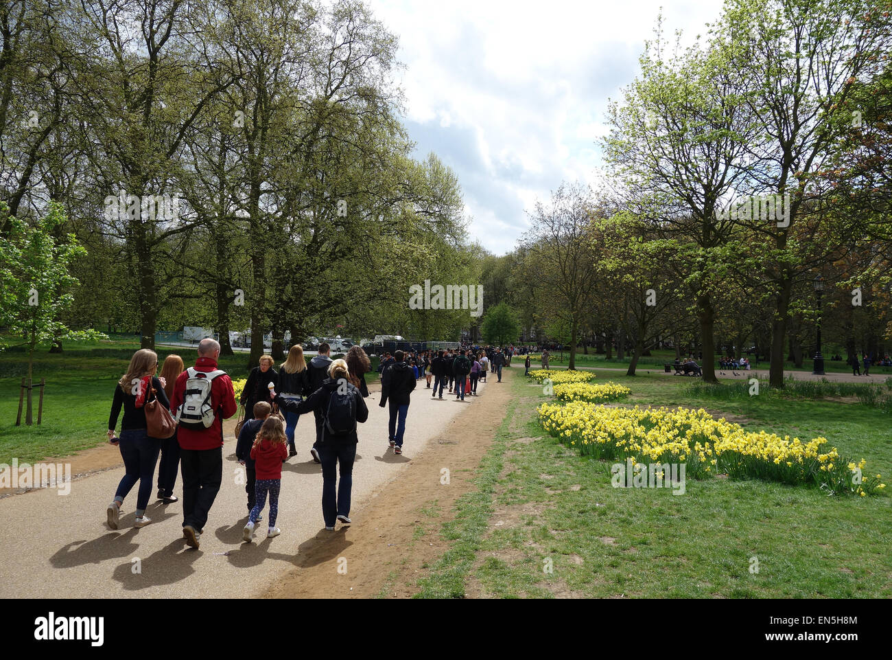 People walking through Green Park in spring, in central London, England ...