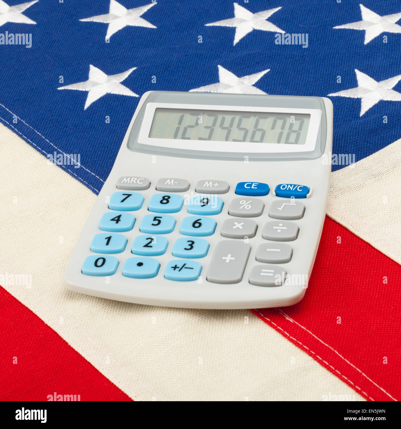 Calculator over huge USA flag - accounting concept Stock Photo - Alamy