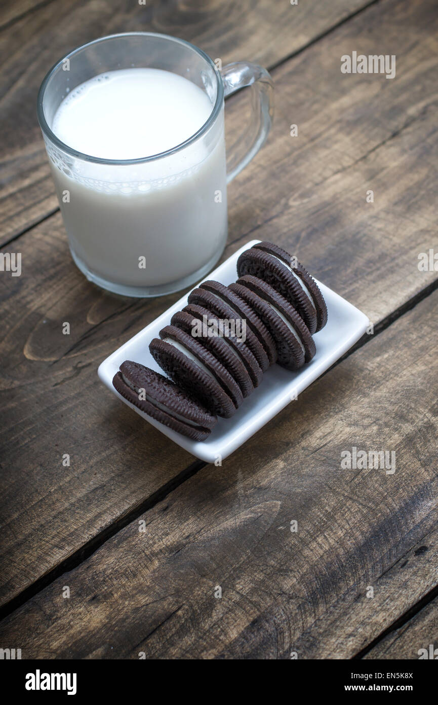Chocolate oreo cookies and milk on the table Stock Photo - Alamy