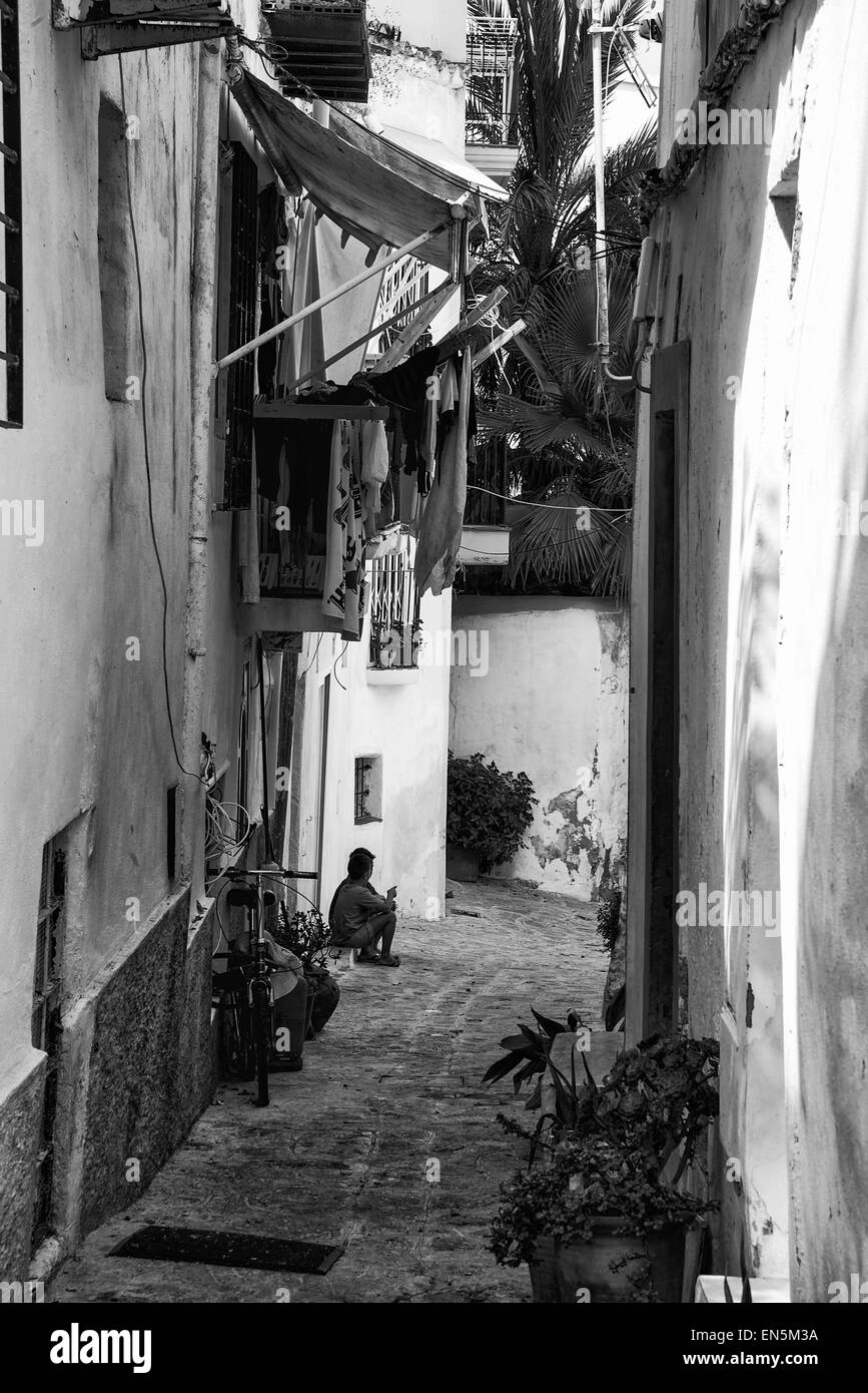 Mediterranean alley way between old houses and buildings black and ...