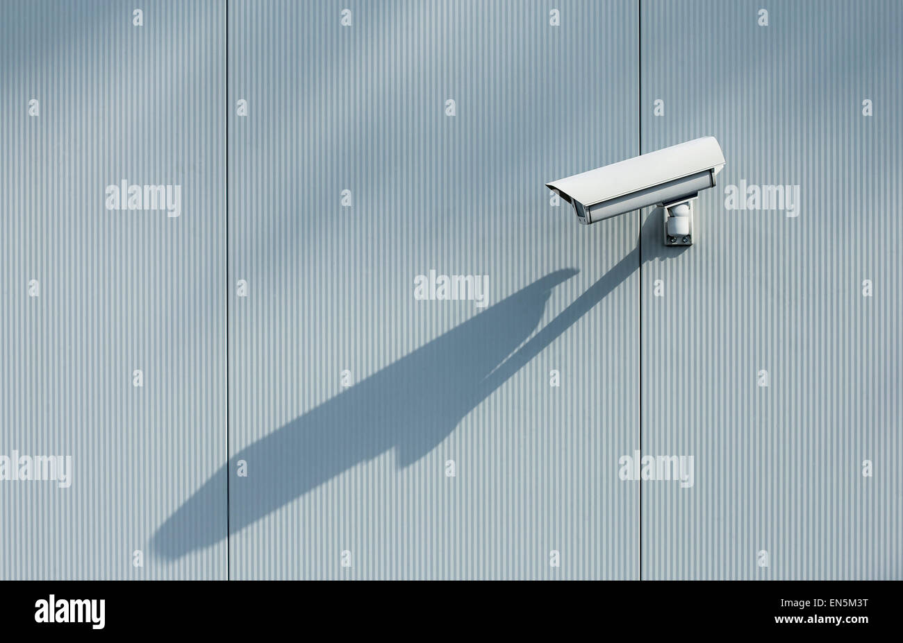 Security camera mounted on a wall Stock Photo - Alamy