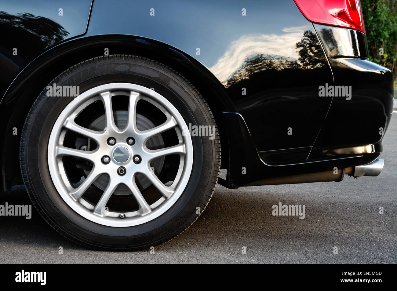 Rear side view of black car wheel Stock Photo - Alamy