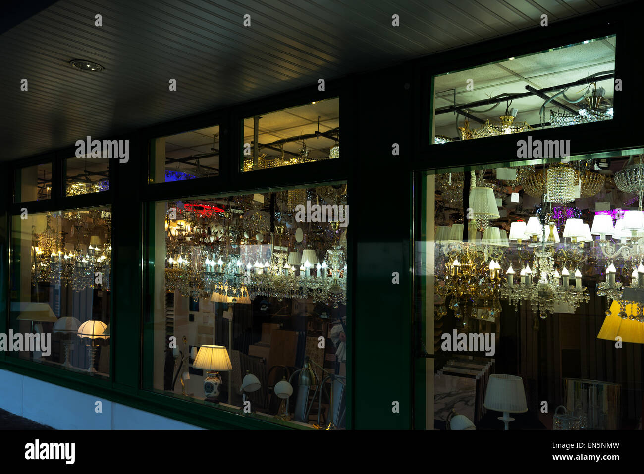 lights behind the windows storefront at night Stock Photo - Alamy