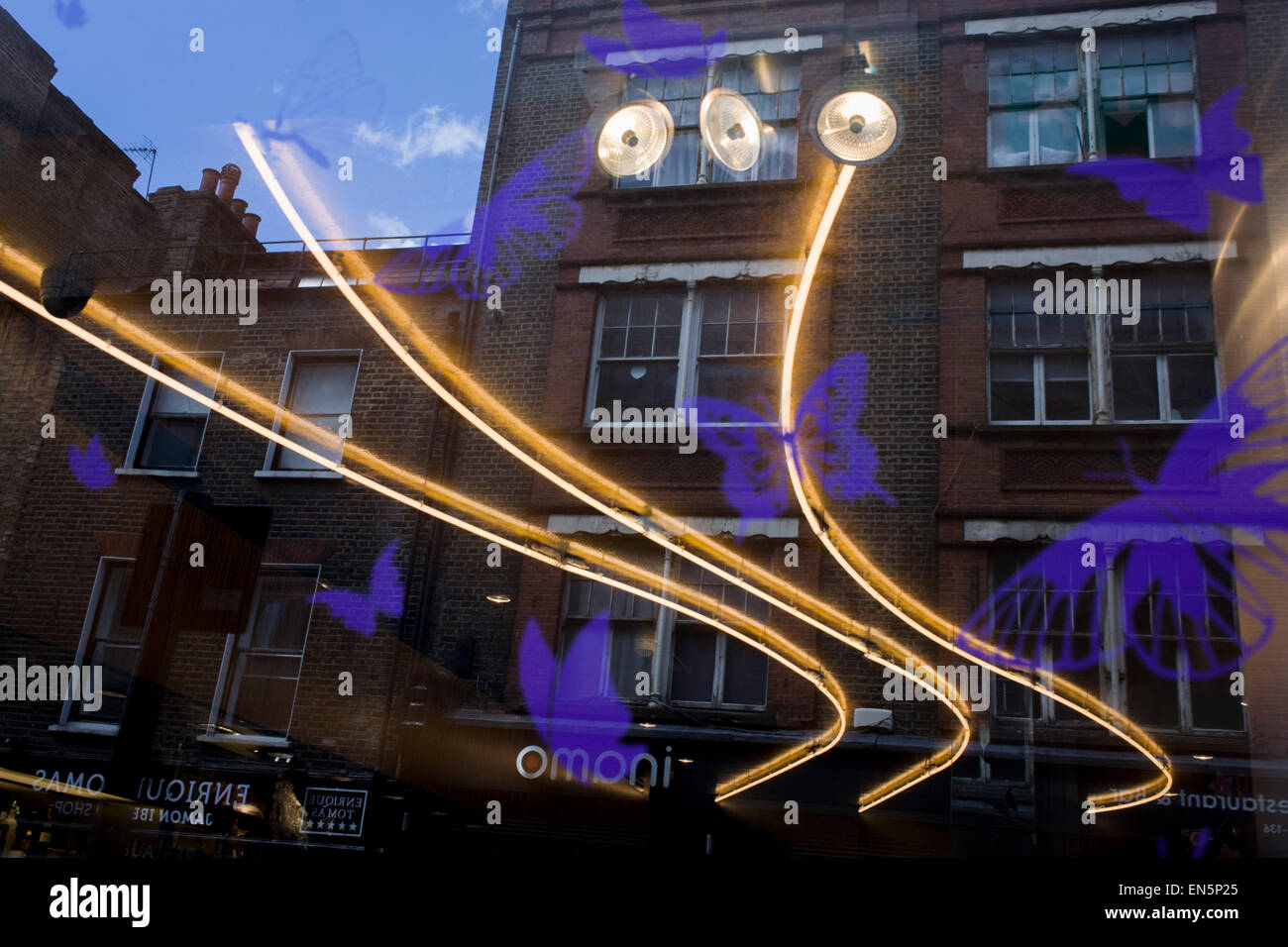Ceiling lights from inside a trendy Soho cafe, with old buildings ...