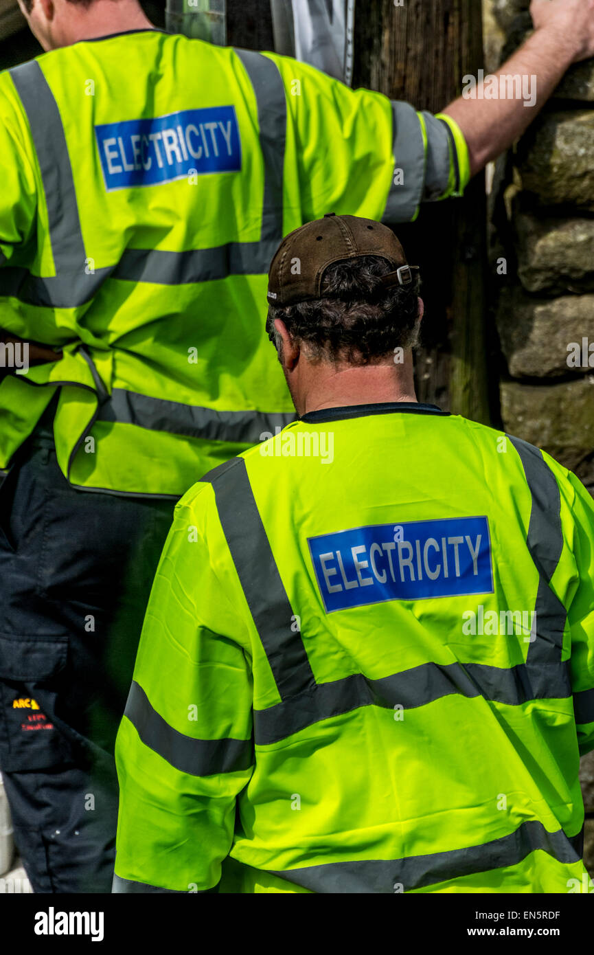 Electricity; Men at work Stock Photo - Alamy