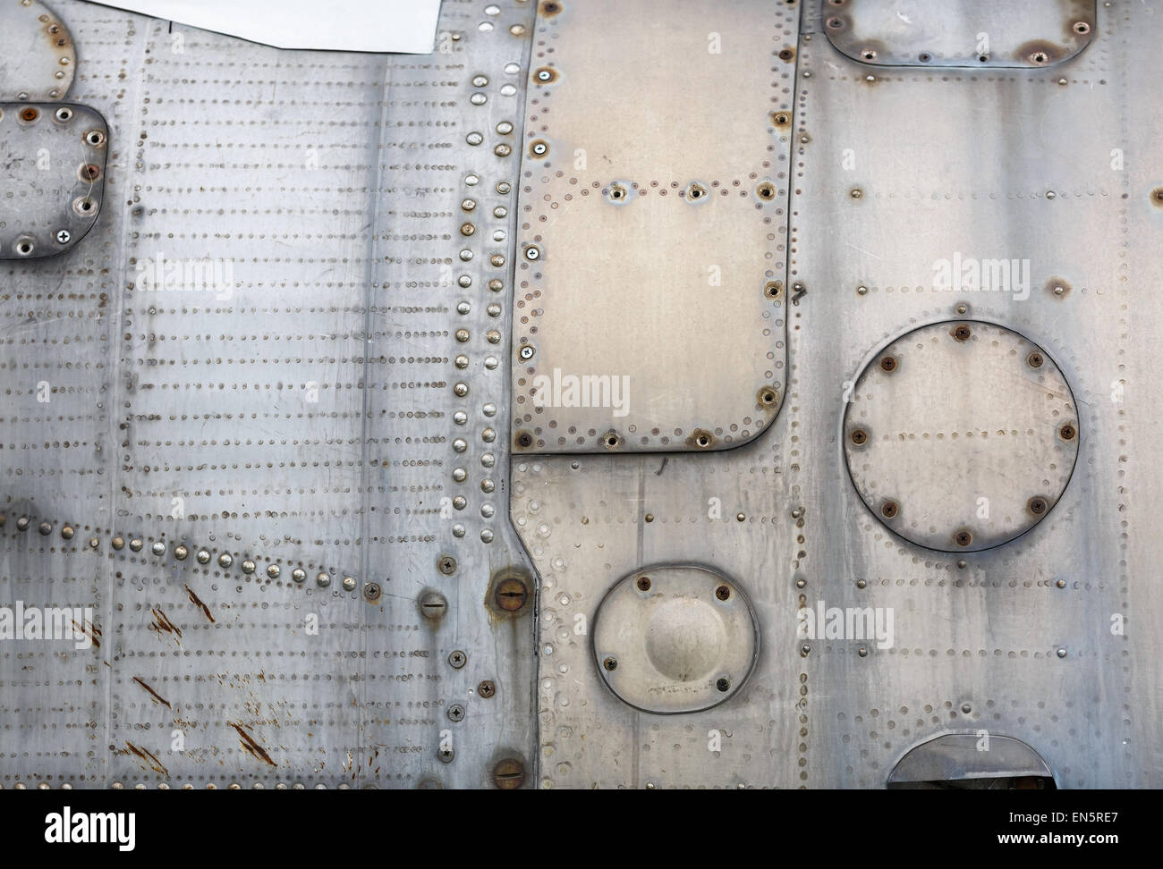 Abstract vintage silver metal background with rivets and bolts. Part of ...