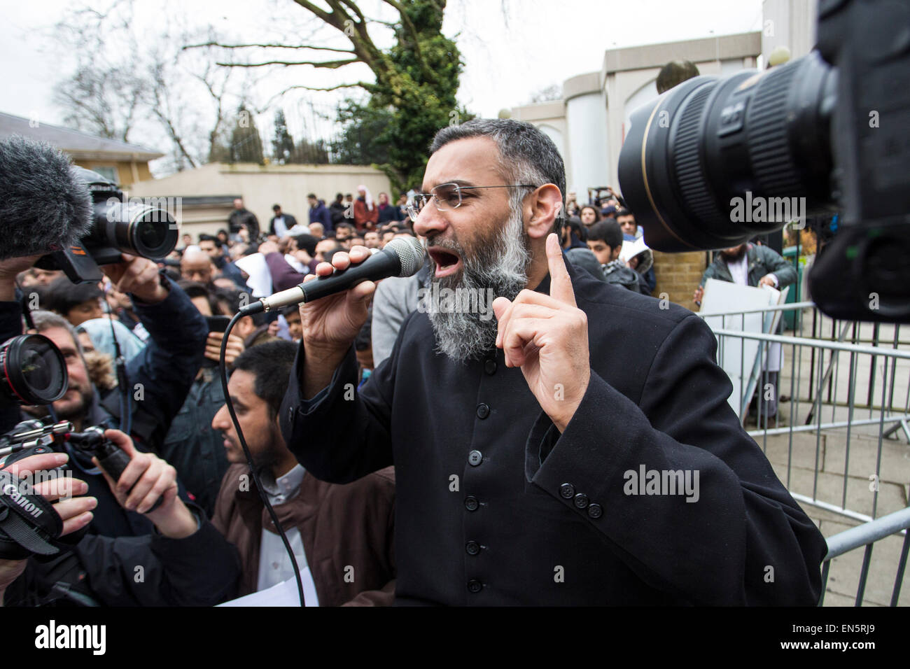 Preacher Anjem Choudary addresses a crowd outside Regents Park Mosque ...