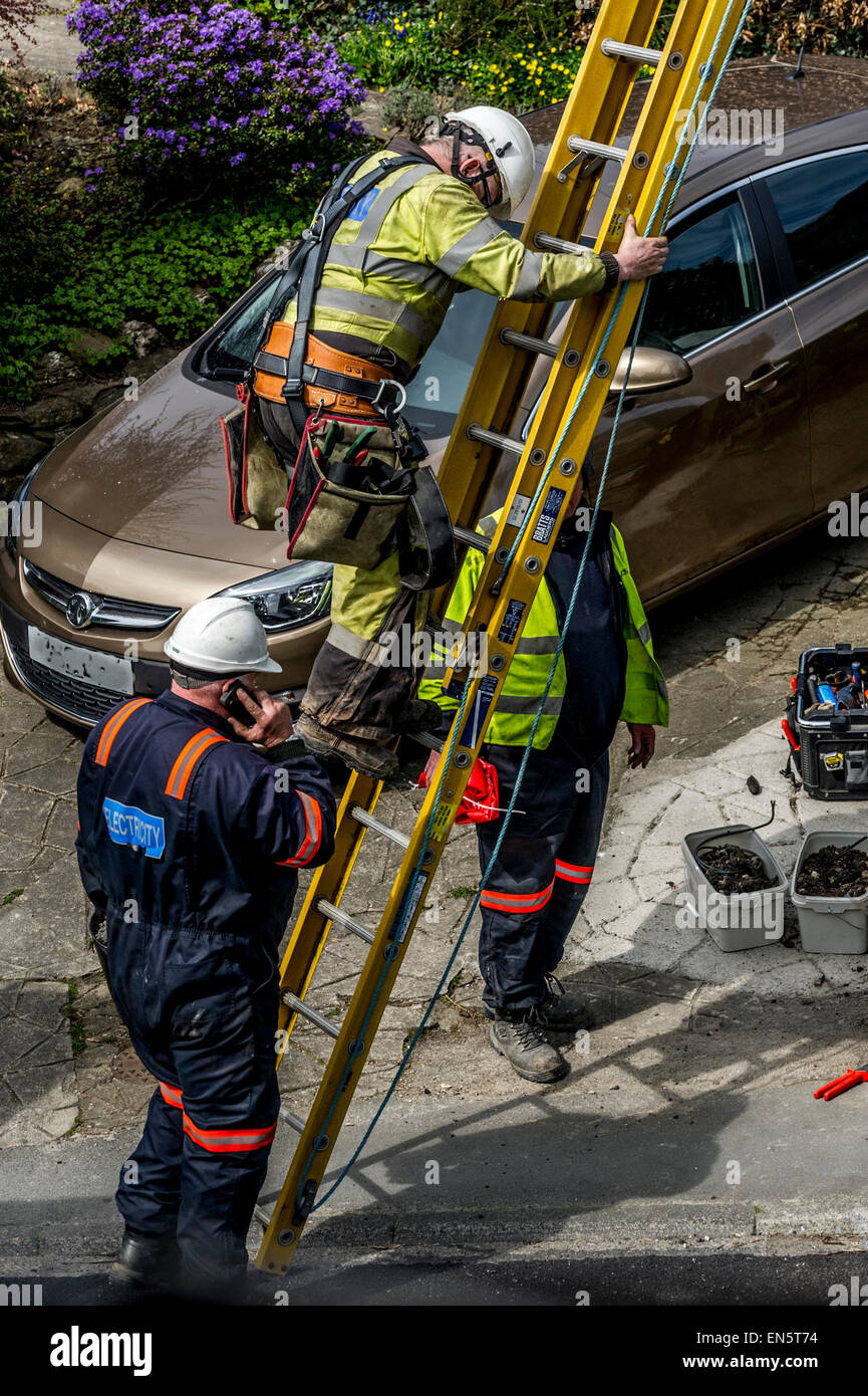 Electricity; Men at work Stock Photo - Alamy