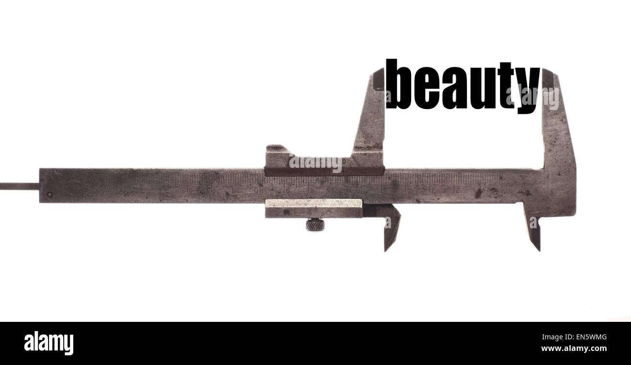 Color horizontal shot of a caliper and measuring the word "beauty Stock ...