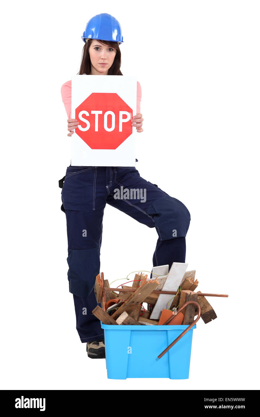 girl with safety helmet holding stop sign Stock Photo - Alamy