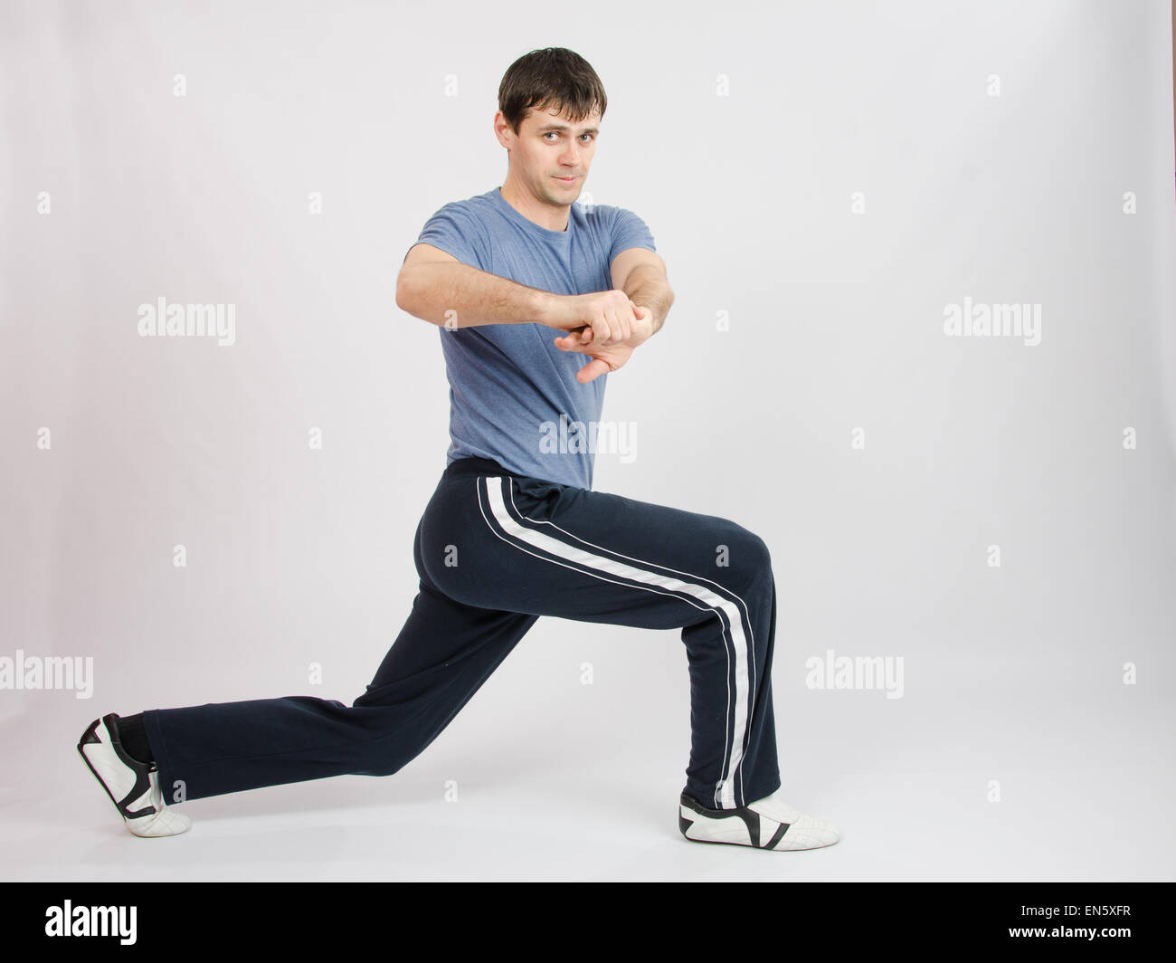 thirty young athletic man does physical exercises Stock Photo - Alamy