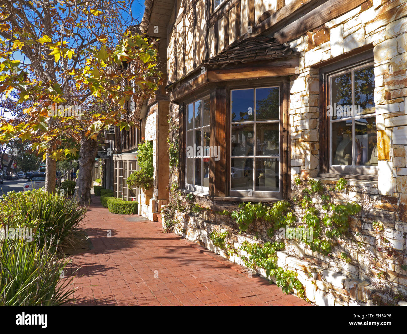 Neat clean autumnal street scene of quaint shops and art galleries ...