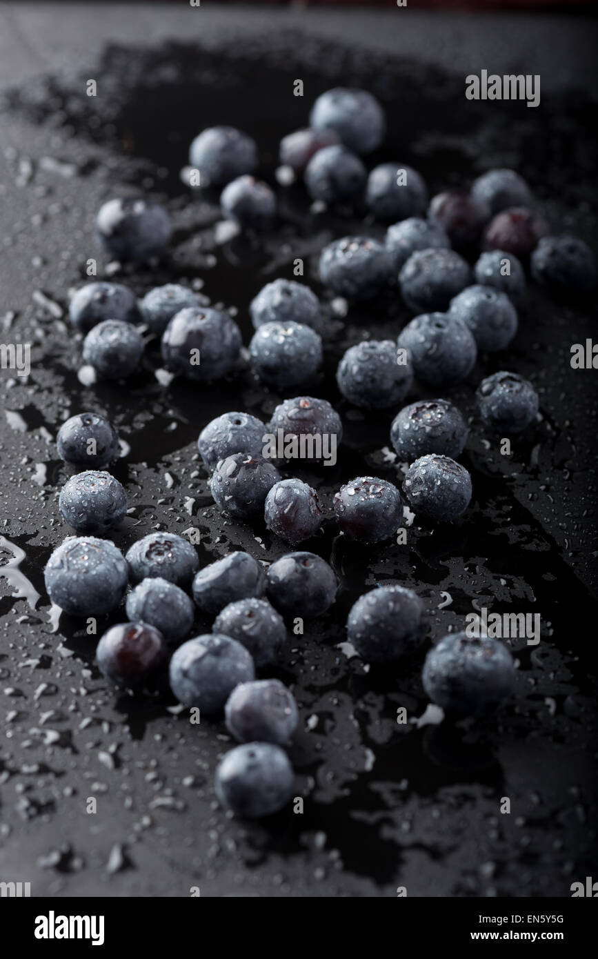 Wet blueberries on black slate Stock Photo - Alamy