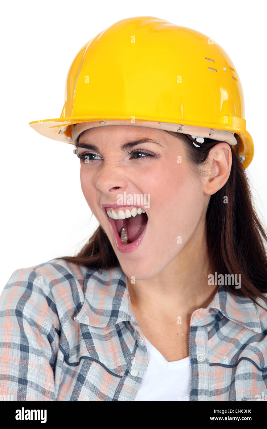 Female builder shouting Stock Photo - Alamy