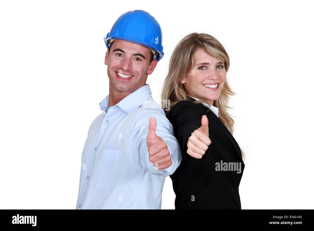 Engineer and a tradesman giving the thumb's up Stock Photo - Alamy