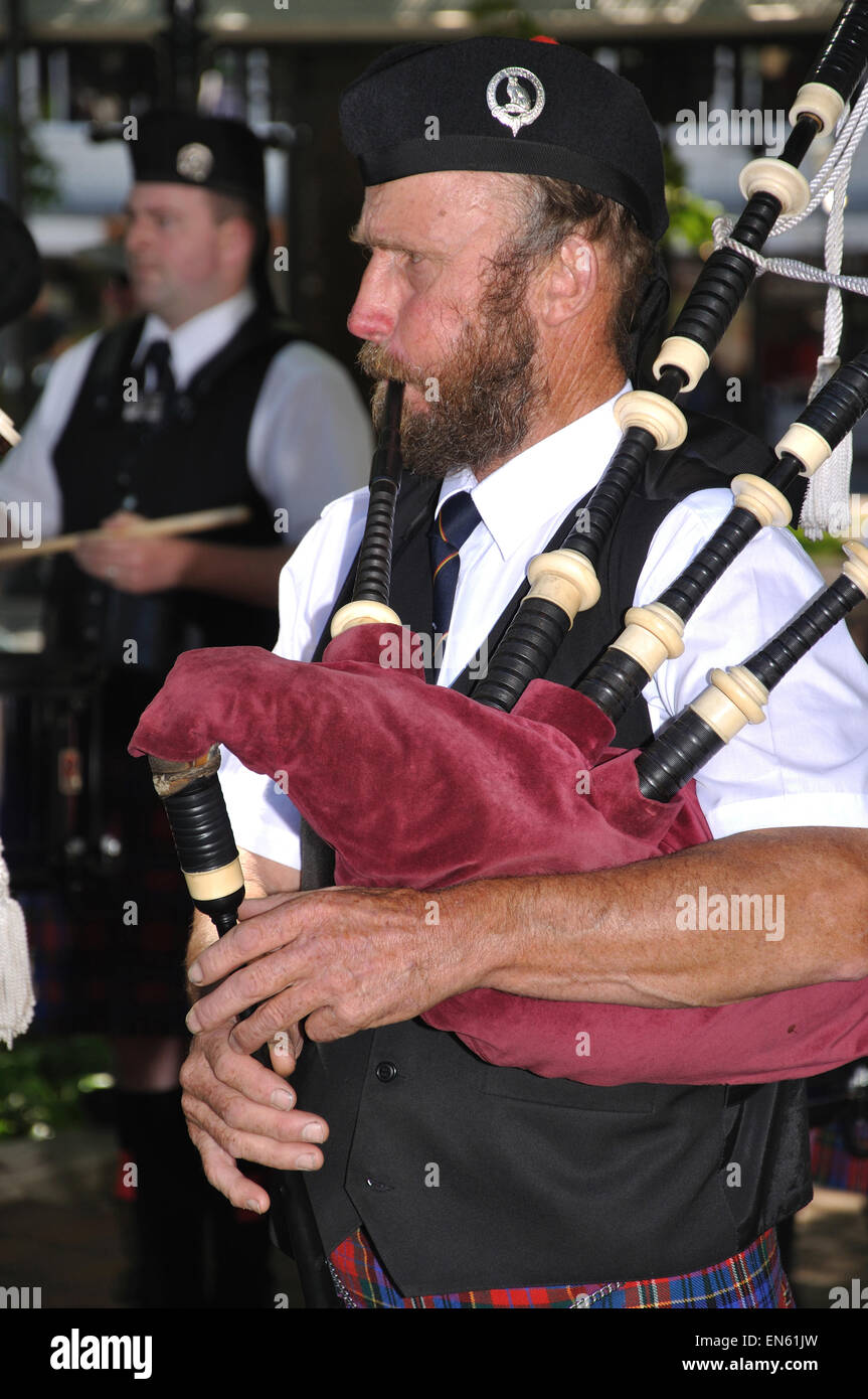 DUNEDIN, NEW ZEALAND, FEBRUARY 21, 2010: pipe band members perform in ...