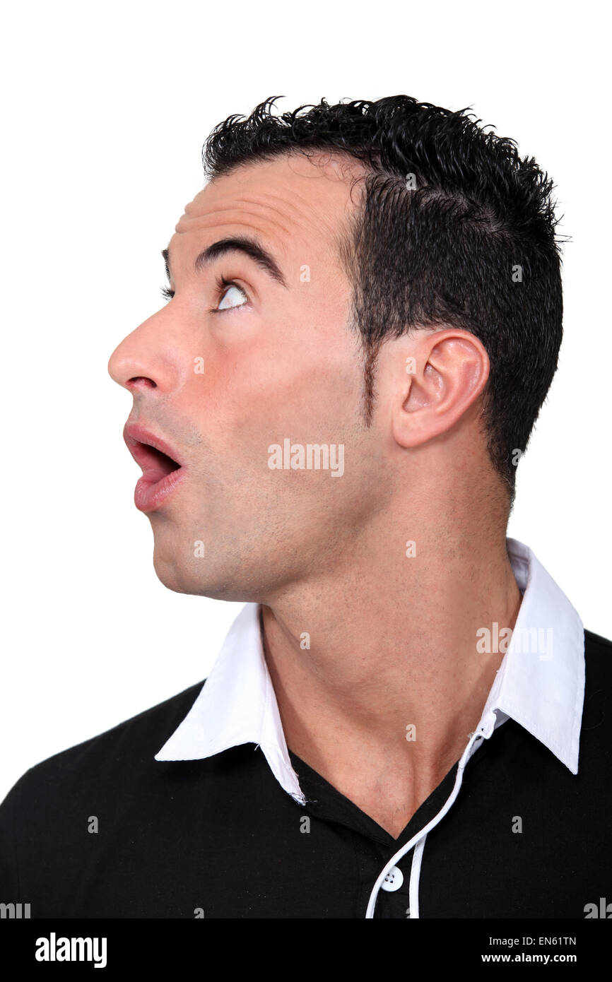 Portrait of a young man shocked Stock Photo - Alamy