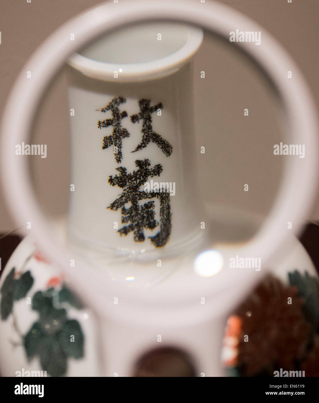 Toronto, Canada. 28th Apr, 2015. An artwork is seen by a magnifying ...