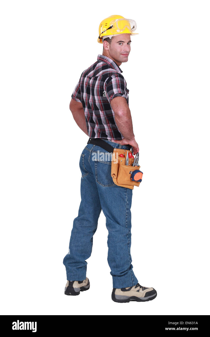 Portrait of a tradesman looking over his shoulder Stock Photo - Alamy