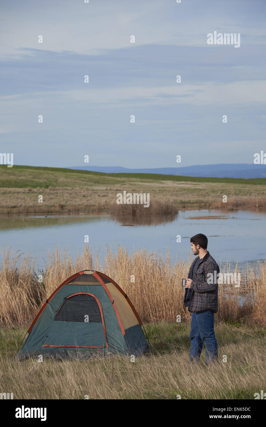 Person standing next to tent hi-res stock photography and images - Alamy