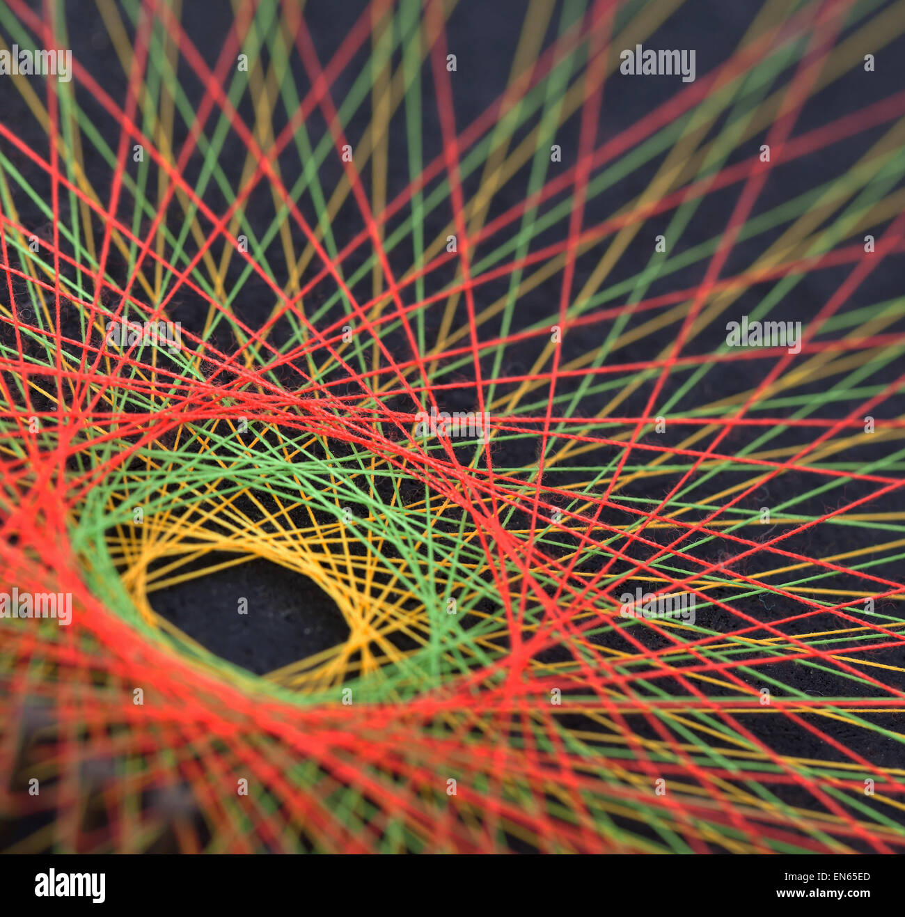 Display of colorful threads on a black panel Stock Photo - Alamy