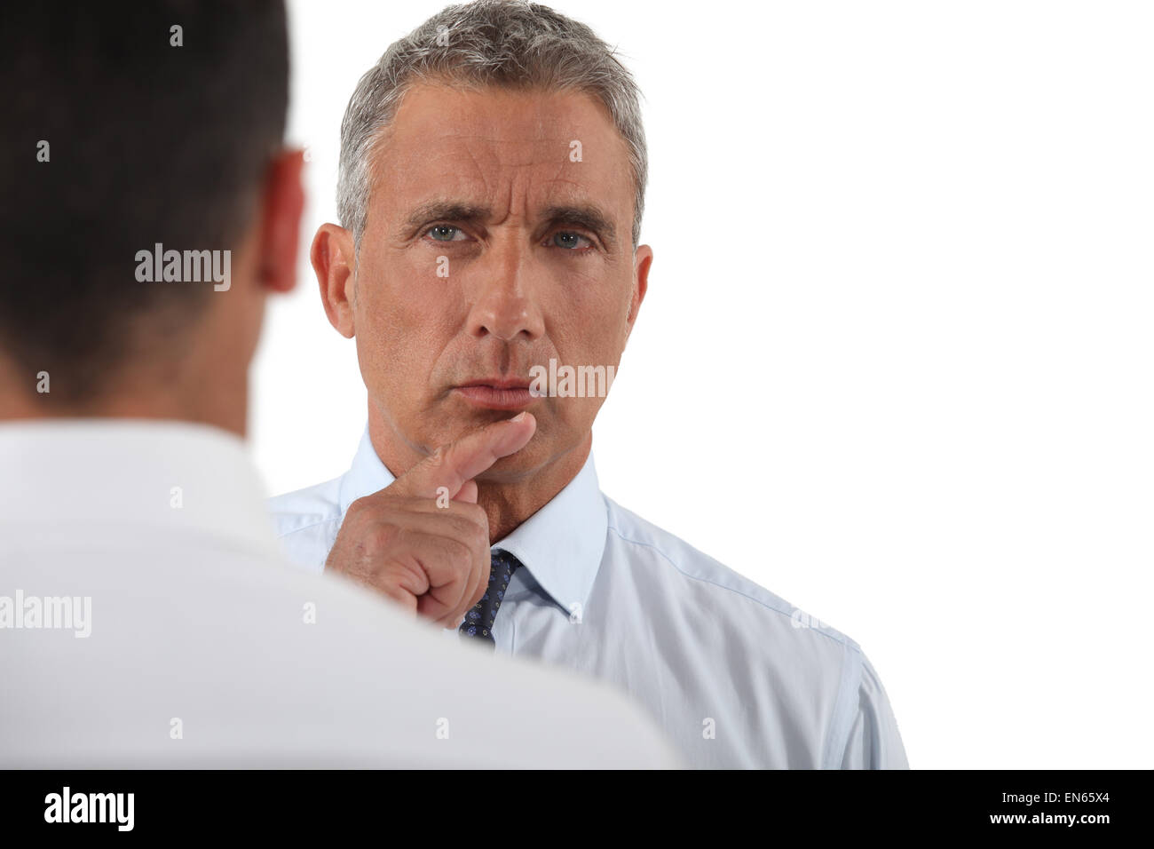 Boss giving orders to employee Stock Photo - Alamy