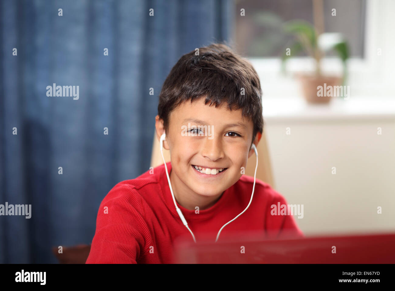 Young boy doing his homework on a computer - with shallow depth of ...