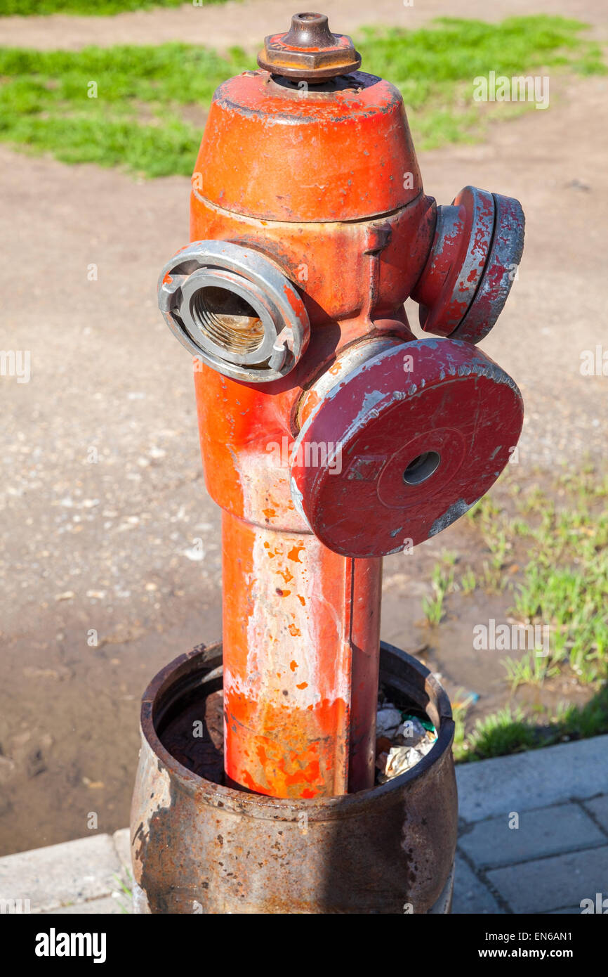 Red used fire hydrant, close up vertical photo Stock Photo - Alamy