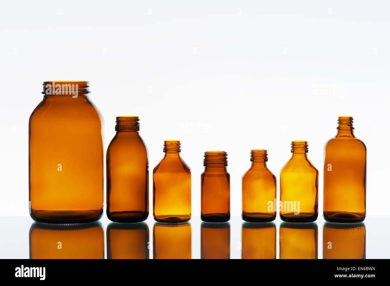 Empty medicine bottles on the light background Stock Photo - Alamy