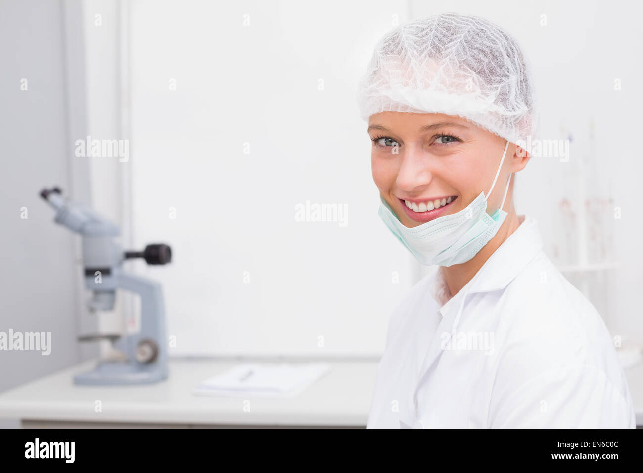 Happy scientist smiling at camera Stock Photo - Alamy