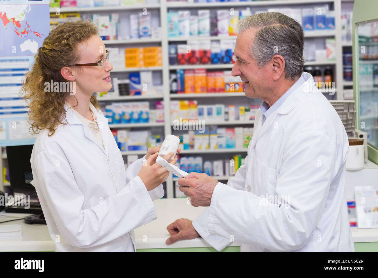 Pharmacists talking together about medication Stock Photo - Alamy