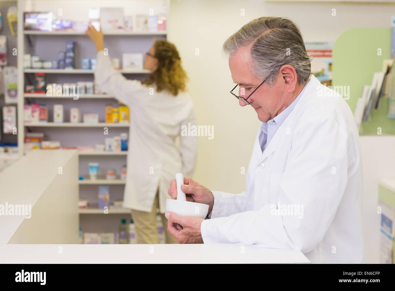 Holding medication mortar hi-res stock photography and images - Alamy