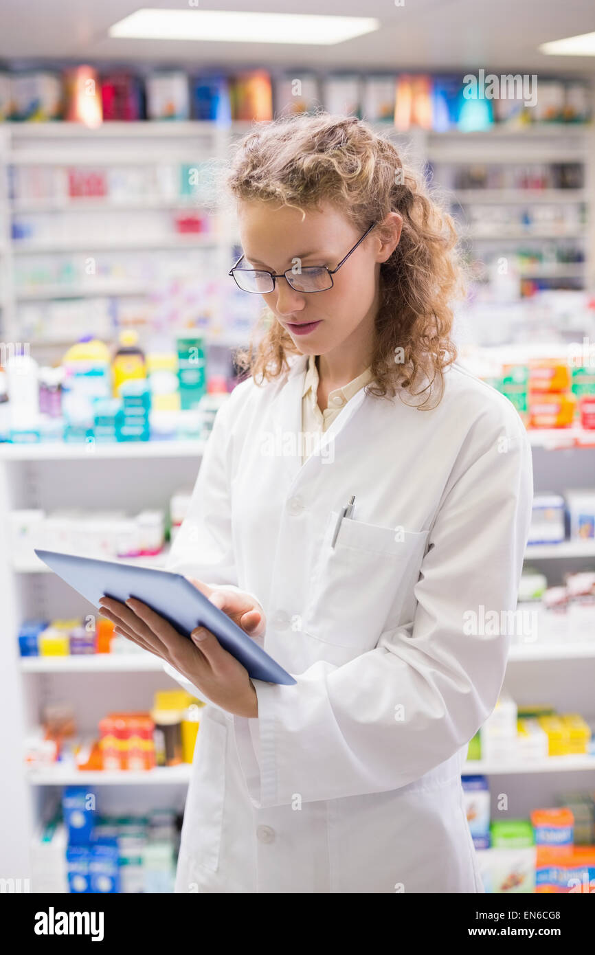 Pharmacist using tablet pc Stock Photo - Alamy