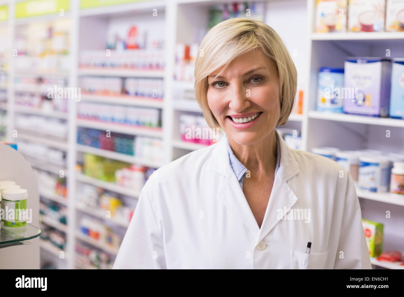 Pharmacist smiling at camera Stock Photo - Alamy