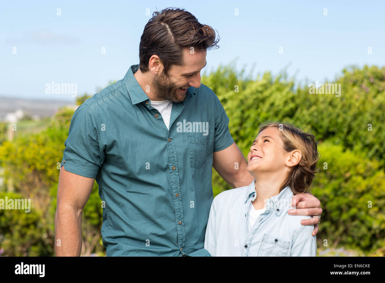 Father and son smiling at each other Stock Photo - Alamy
